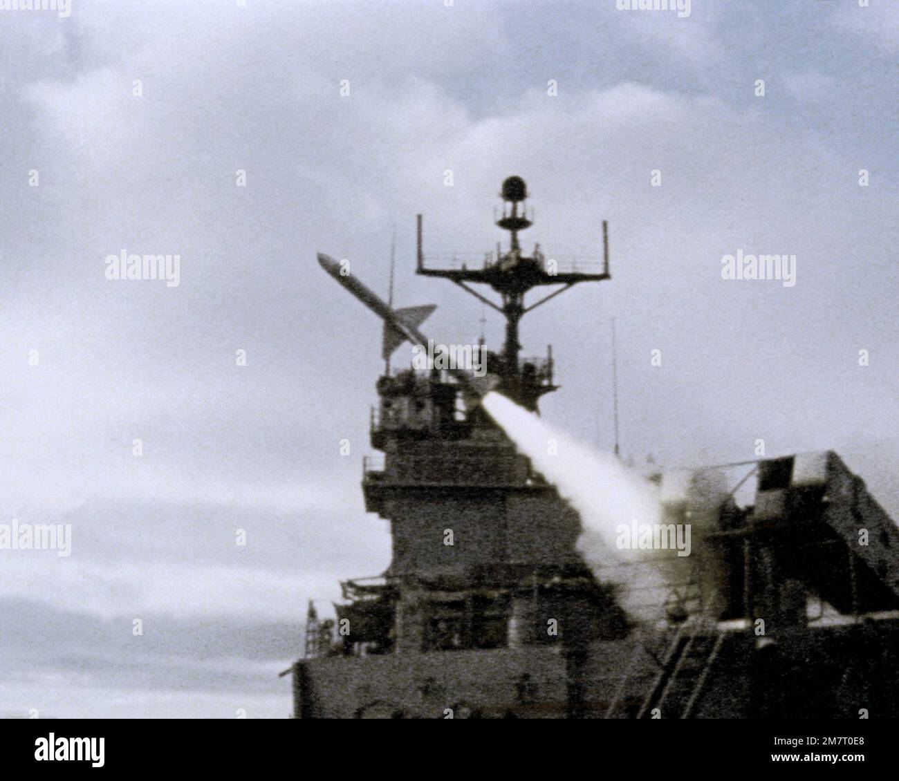 A view of an RIM-7 Sea Sparrow surface-to-air missile silhouetted ...