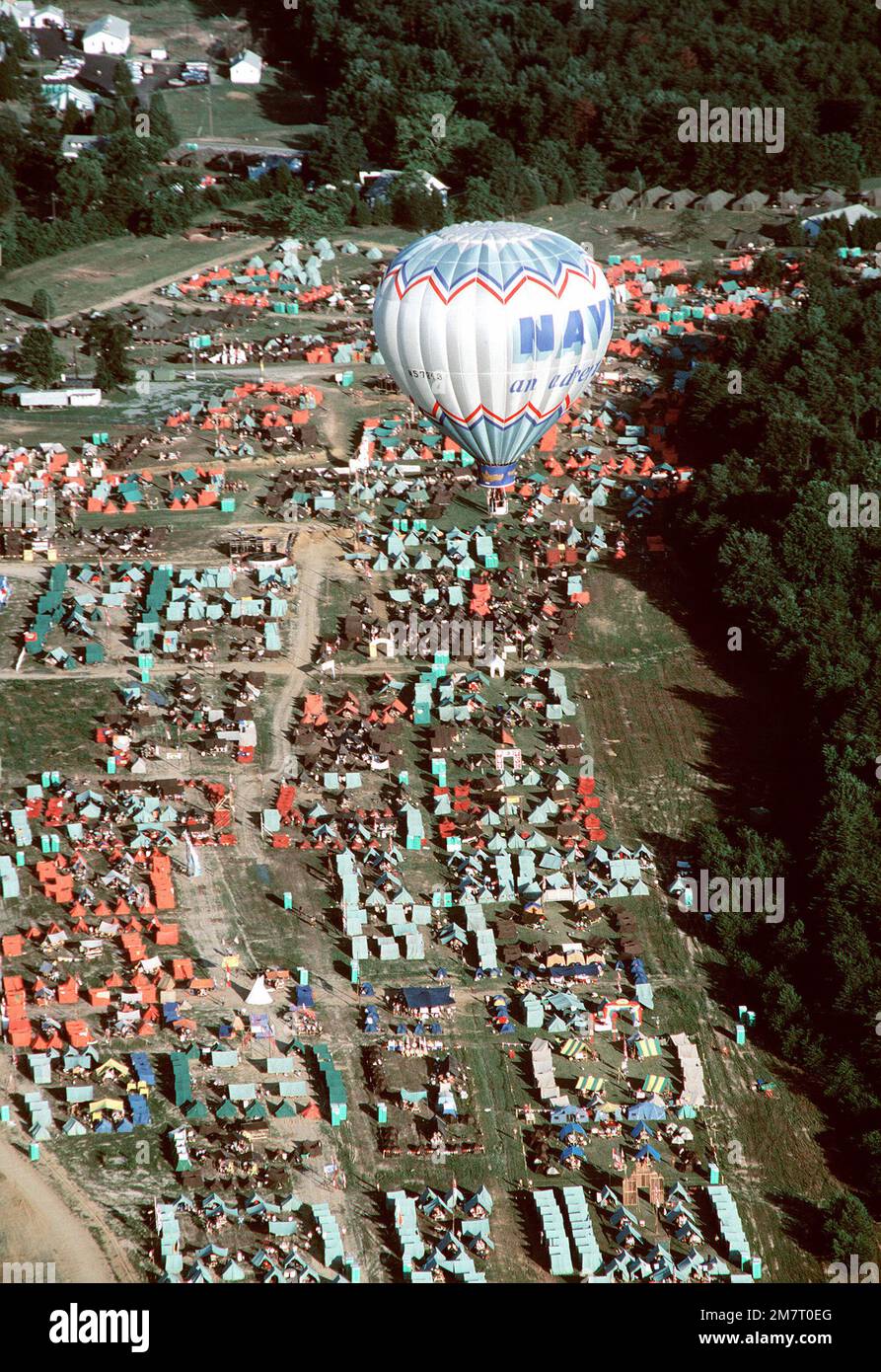 An air-to-air view of the U.S. Navy balloon in flight above the 32,000 ...