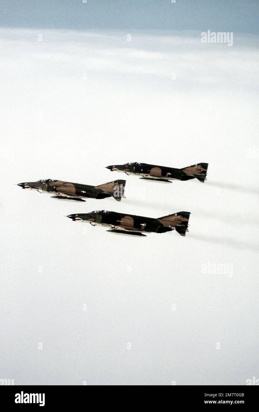 AN air-to-air left side view of three F-4 Phantom II aircraft from the ...