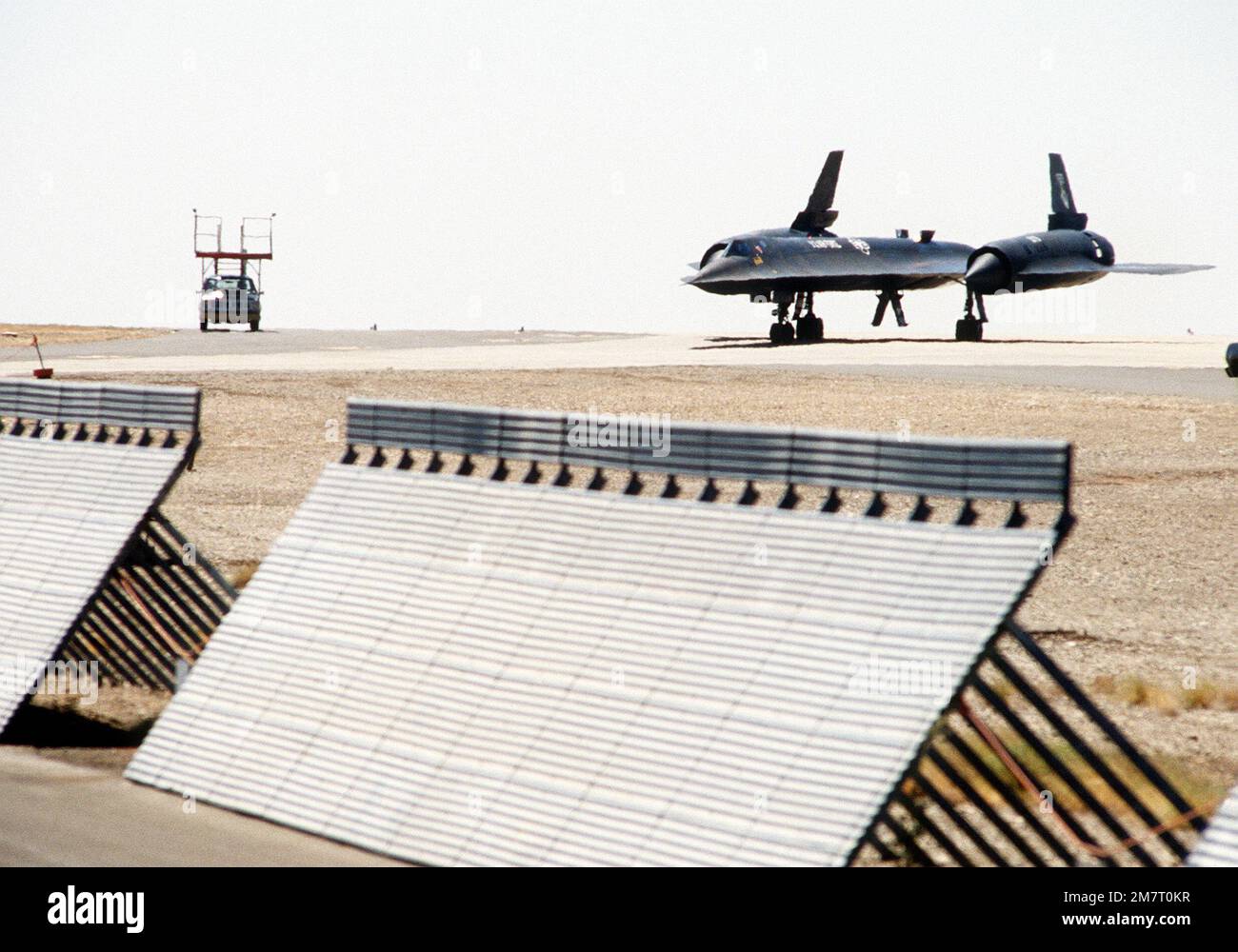 A view of an SR-71 Blackbird aircraft taxiing along the flightline. The ...