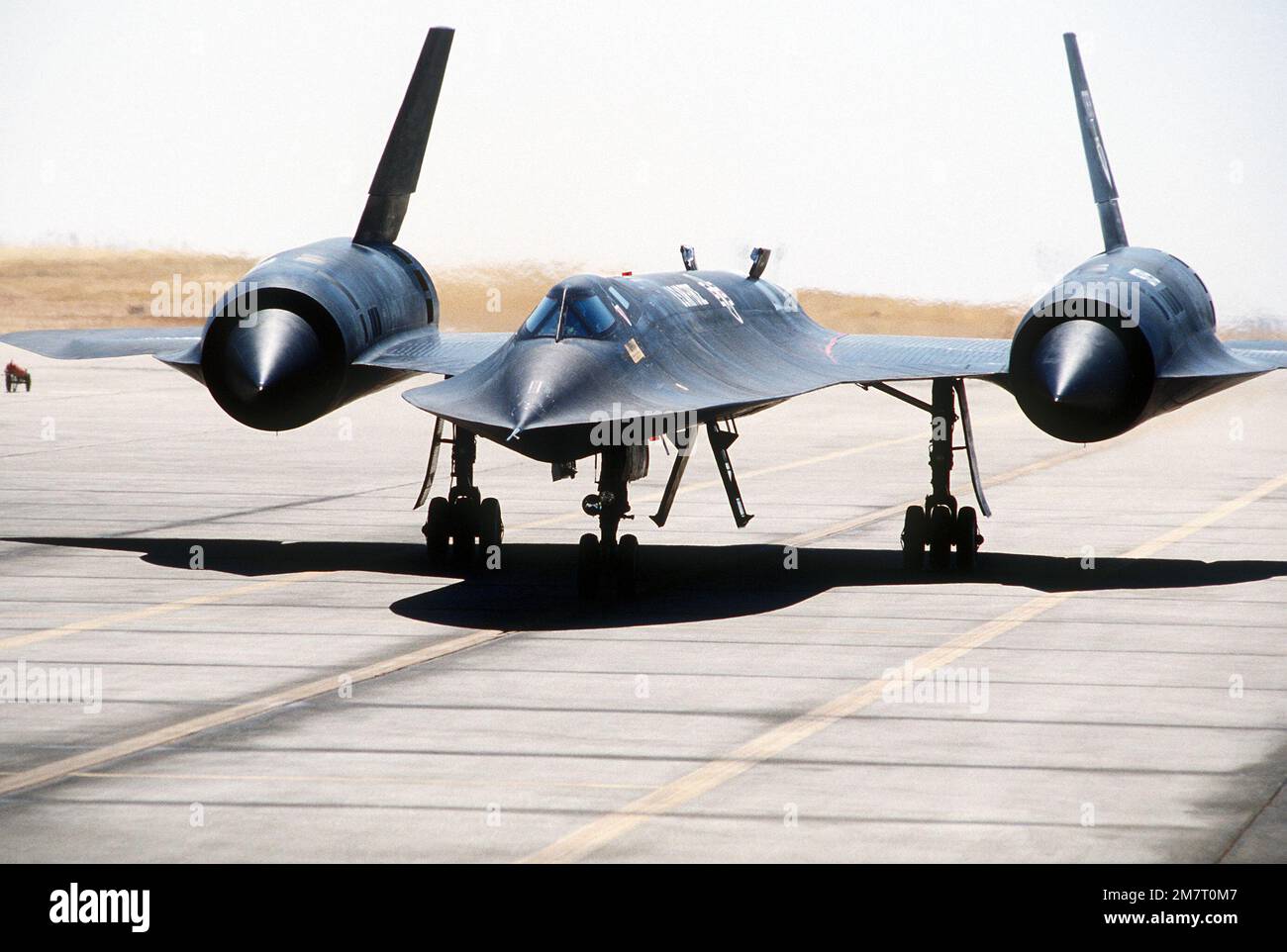 A view of an SR-71 Blackbird aircraft taxiing along the flightline. The ...