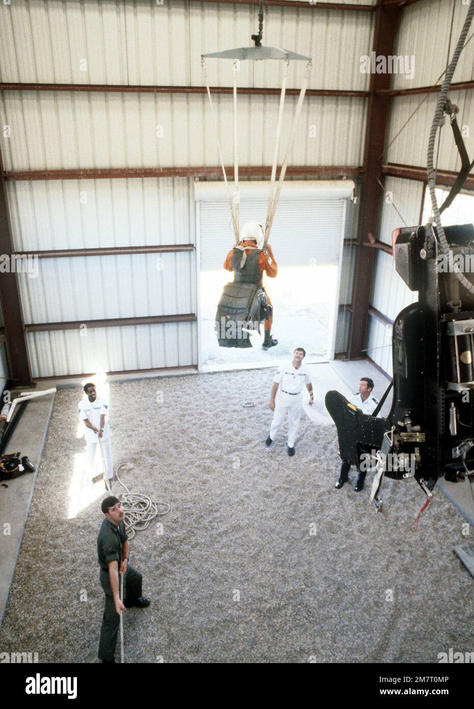 Training chief, MAJ Cliff Cunningham, instructs U-2 aircraft pilot MAJ ...
