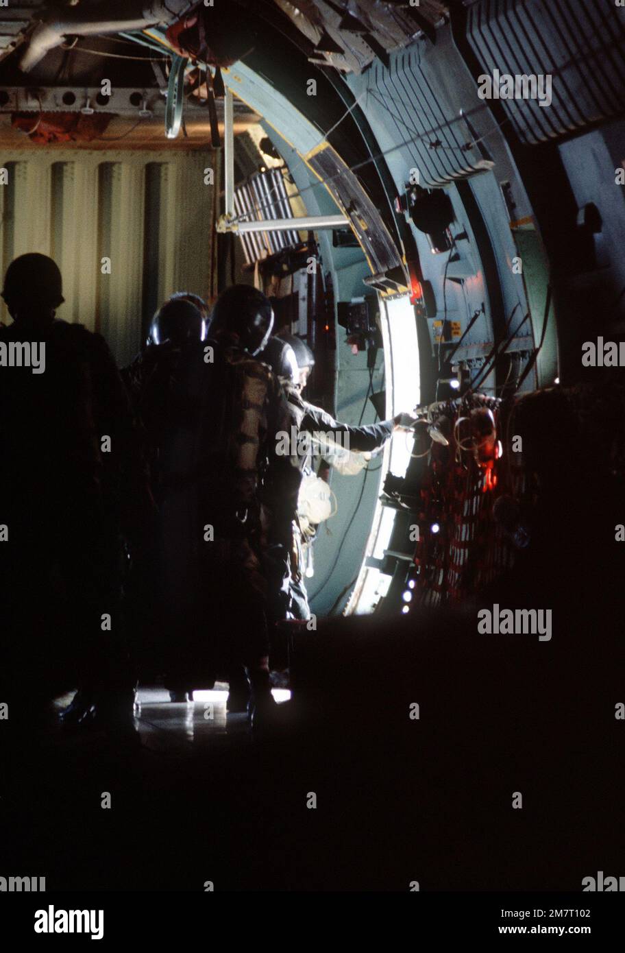 Crew members from the 63rd Military Airlift Wing help airborne Rangers ...