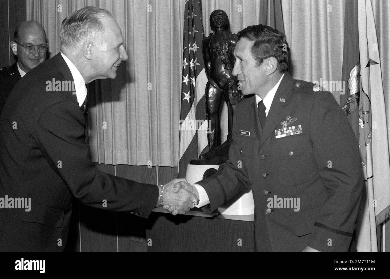 Secretary of Air Force Verne Orr congratulates LCOL Mestre, who ...