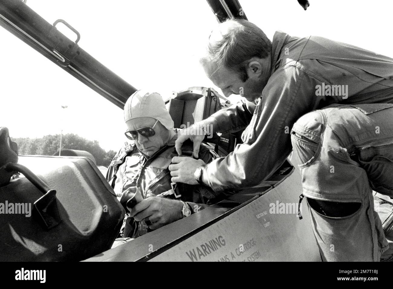 CPT Denny Granquist of the 32nd Tactical Fighter Squadron helps ...