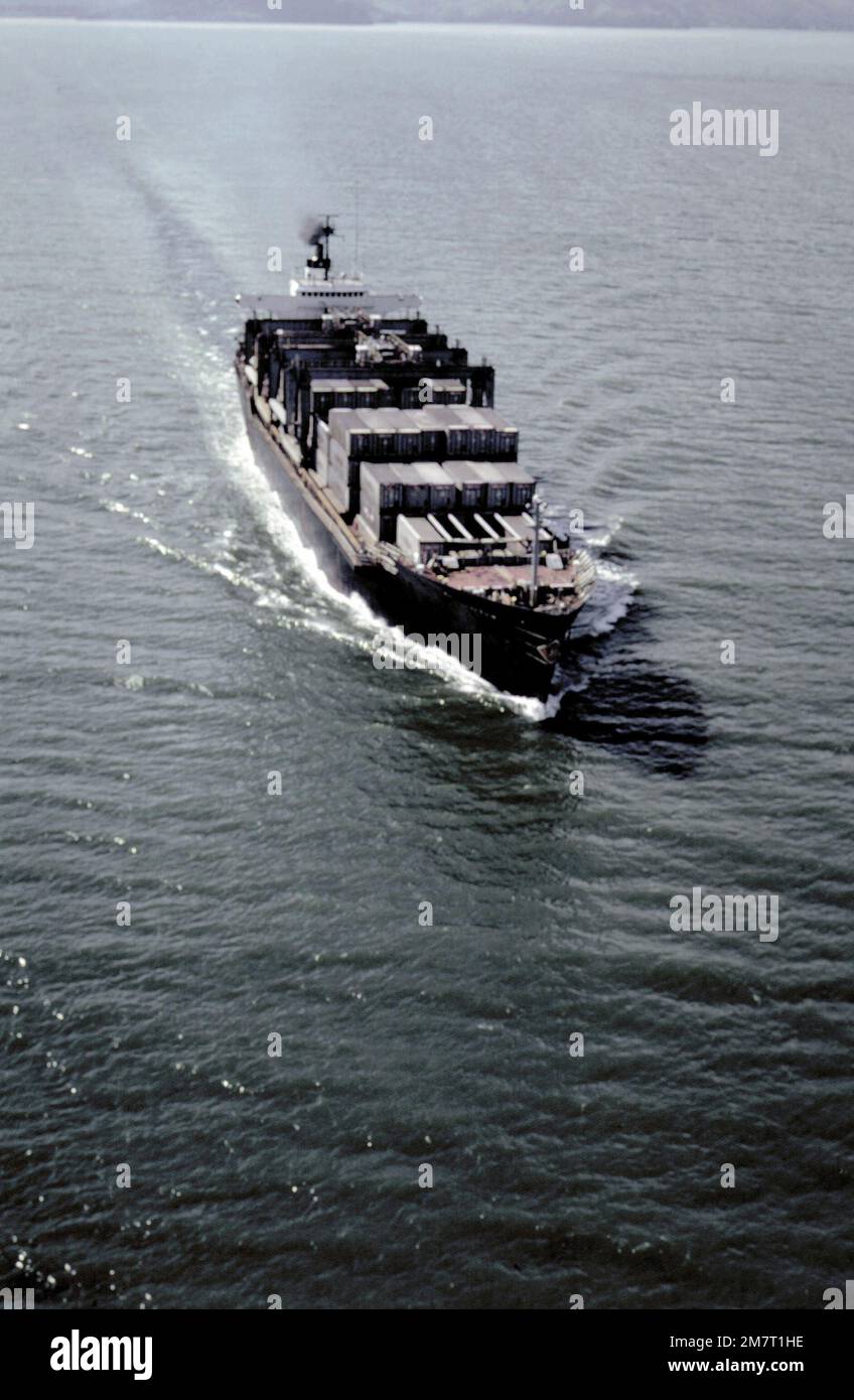 A commercial cargo ship underway with a full load. Base: Naval Station ...