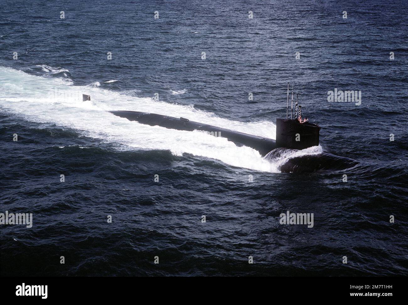 A starboard side view of the nuclear-powered attack submarines USS ...