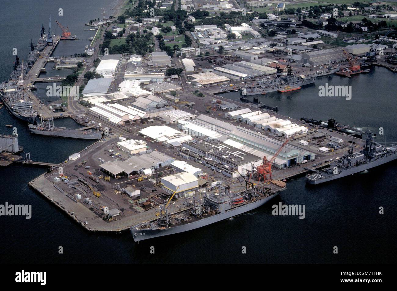 A view of the pier area with docked ships including the auxiliary ...