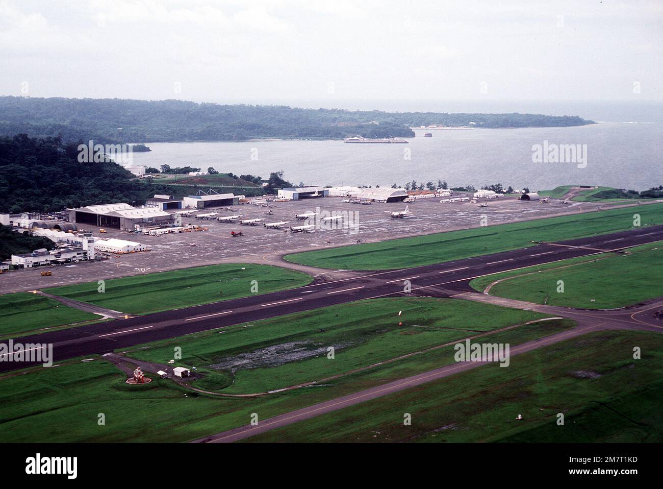 A view of the airfield with aircraft parked near the hangars at the ...