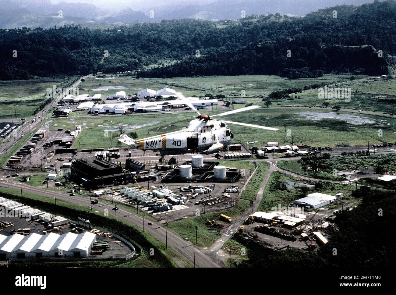 An air-to-air right side view of an SH-3A Sea King helicopter from ...