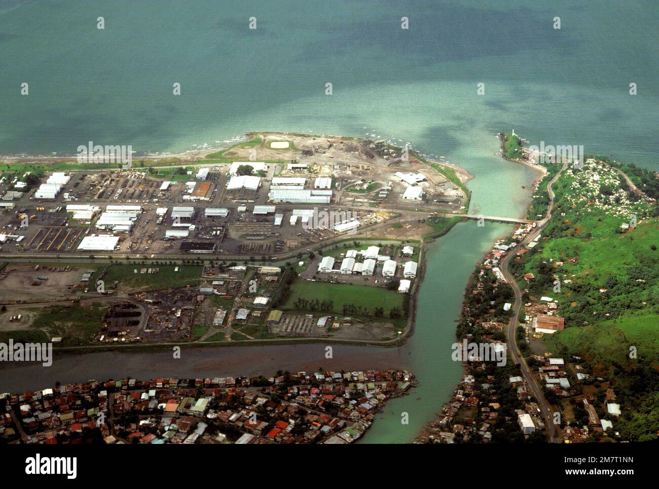 An aerial view, which includes part of the Naval Base, Subic Bay, left ...