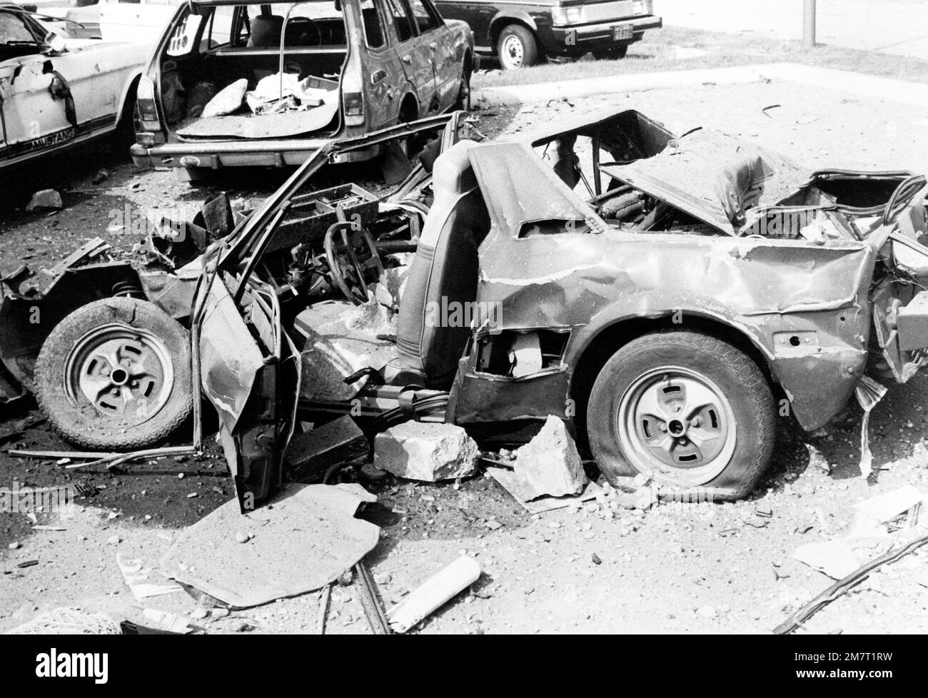 The remains of an automobile destroyed by bombs that also damaged the ...