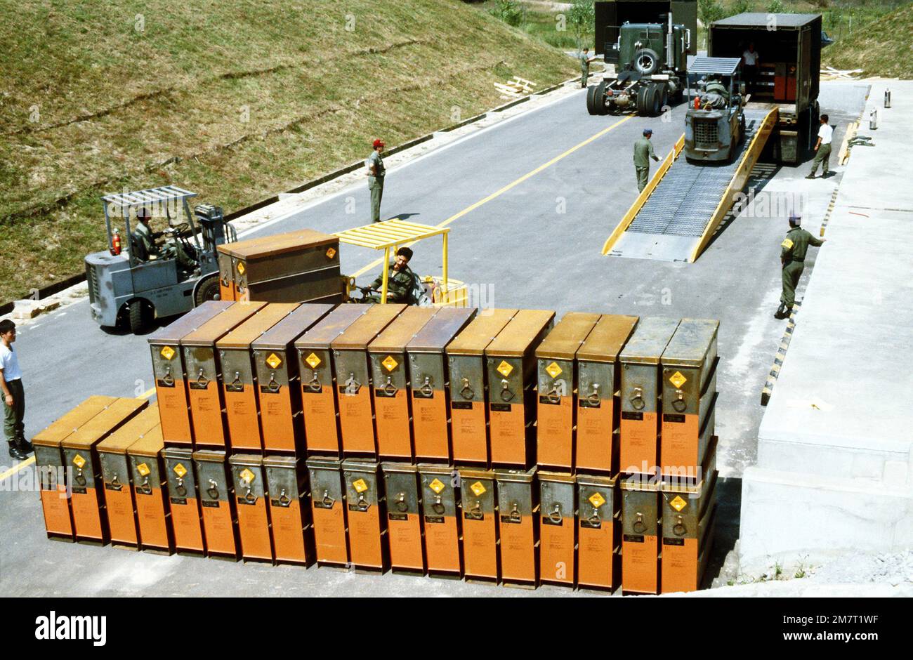 Munitions are stacked after their removal from a military van. They are ...