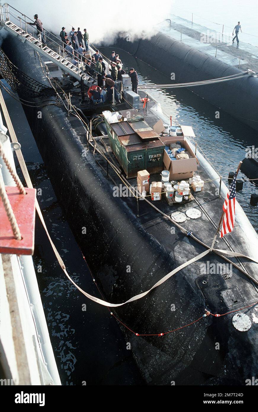 Crewmen load supplies aboard a Benjamin Franklin Class nuclear-powered ...