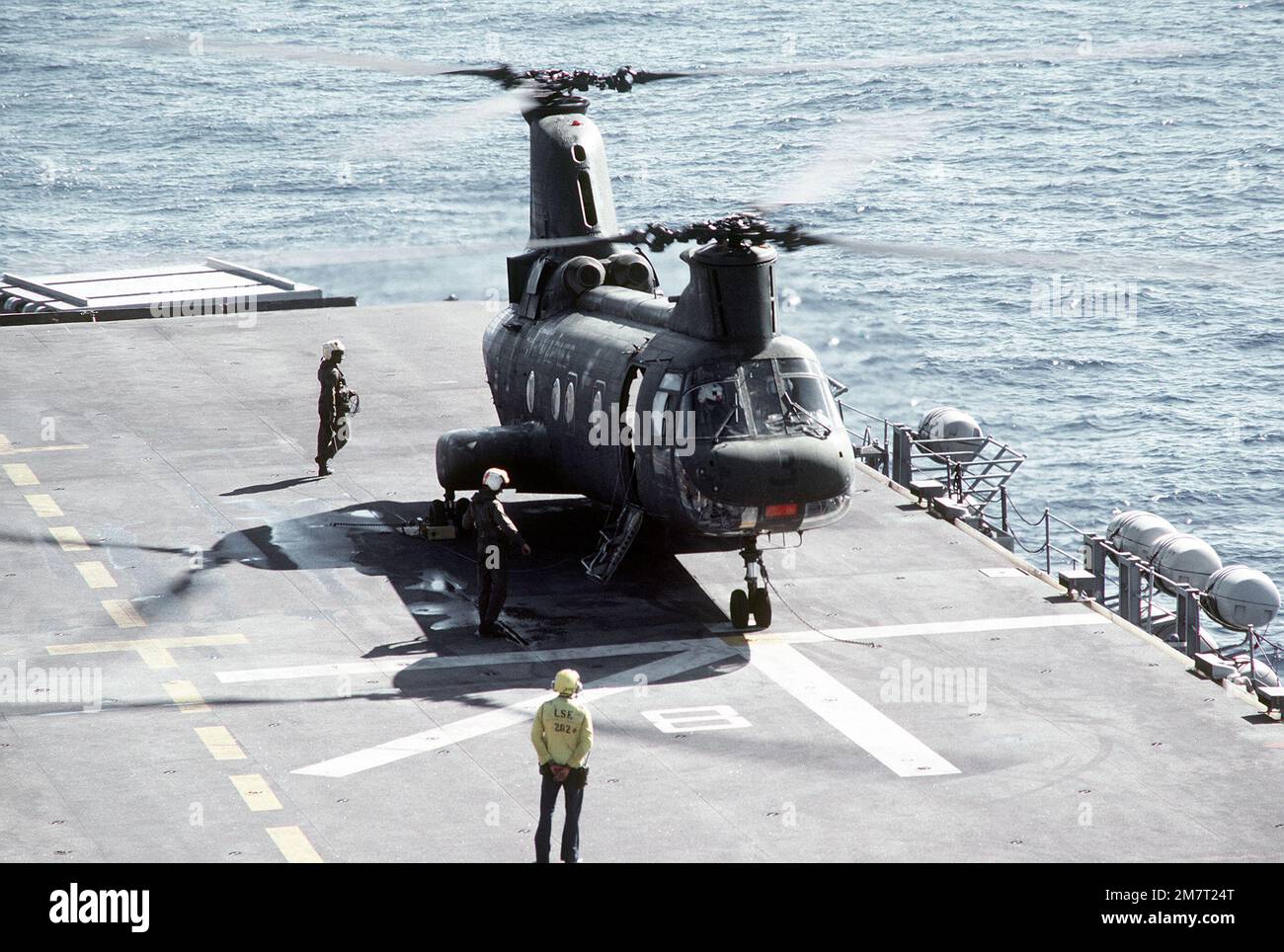 A right side view of a CH-46 Sea Knight helicopter on the flight deck ...