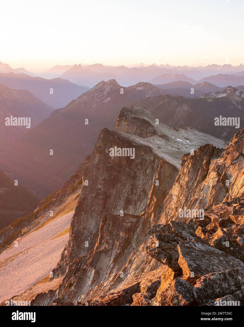 Golden light on a rocky cliff edge in Washington State's Cascade ...