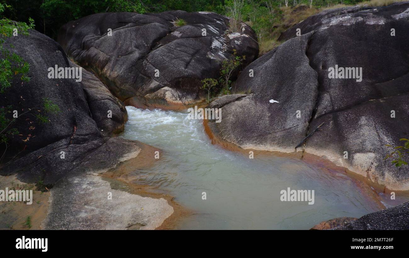 Calm River Water, With Black And Large Mountain Rock Formations Stock ...