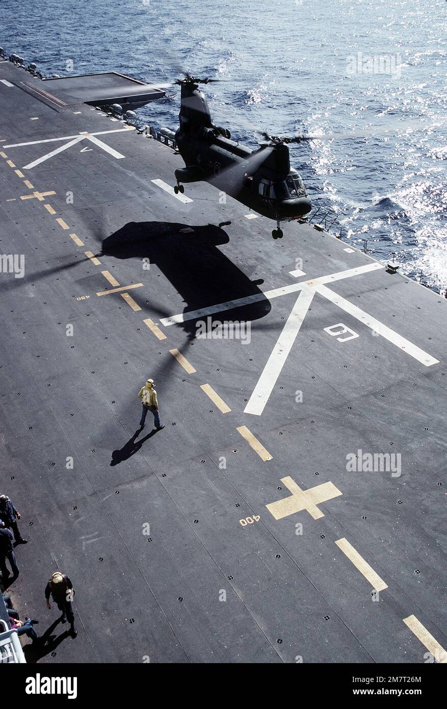 A right side view of a CH-46 Sea Knight helicopter preparing to touch ...