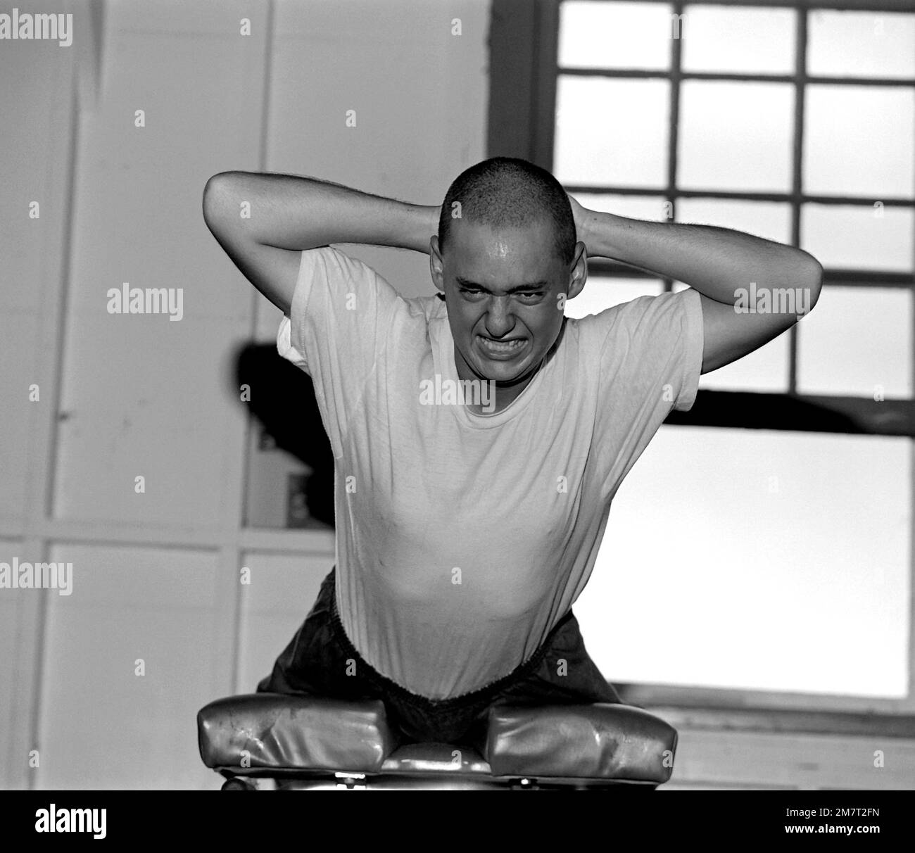 A recruit from the physical conditioning platoon does back extensions ...