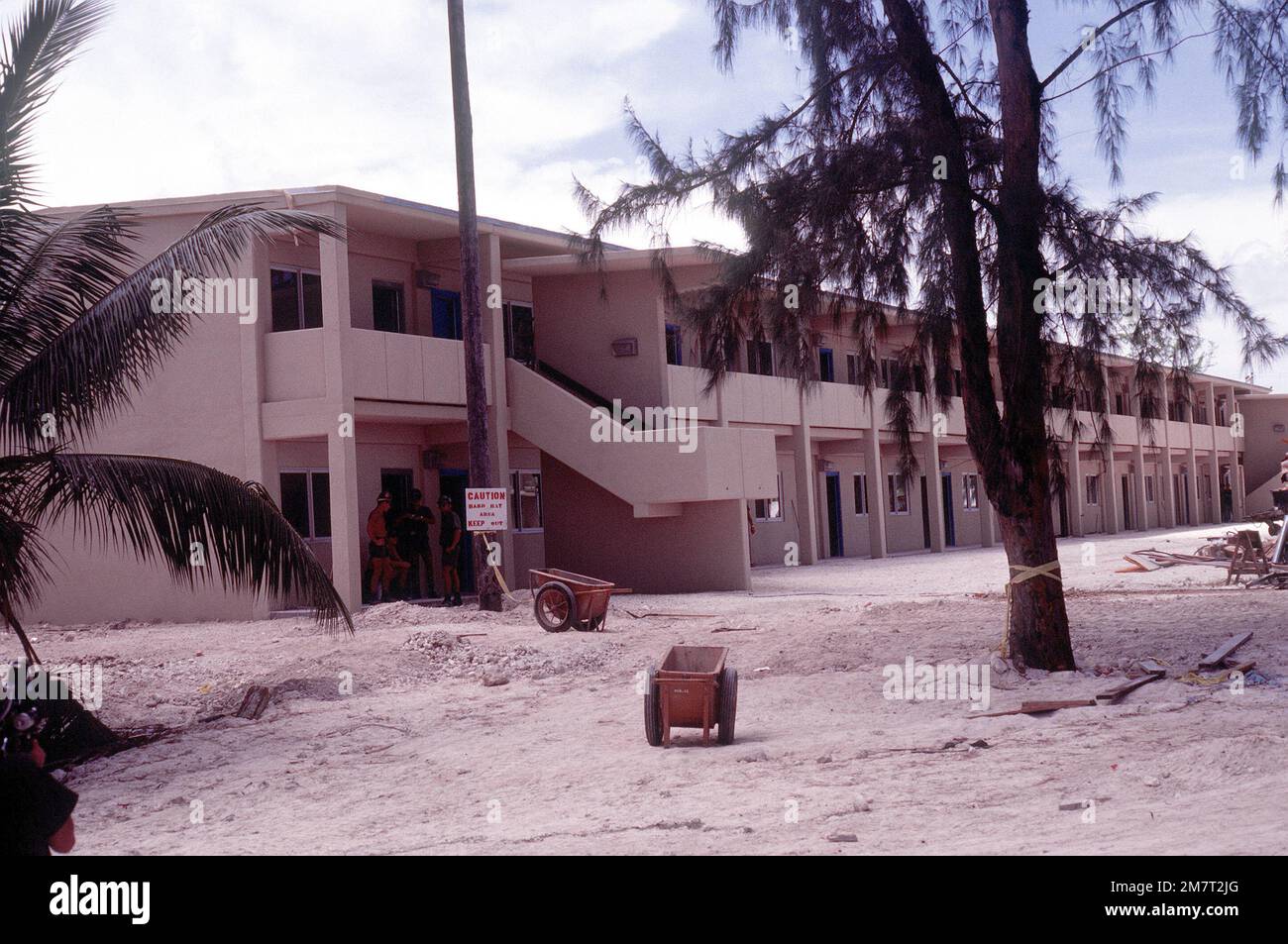 An exterior view of a nearly-completed building during a lull in ...