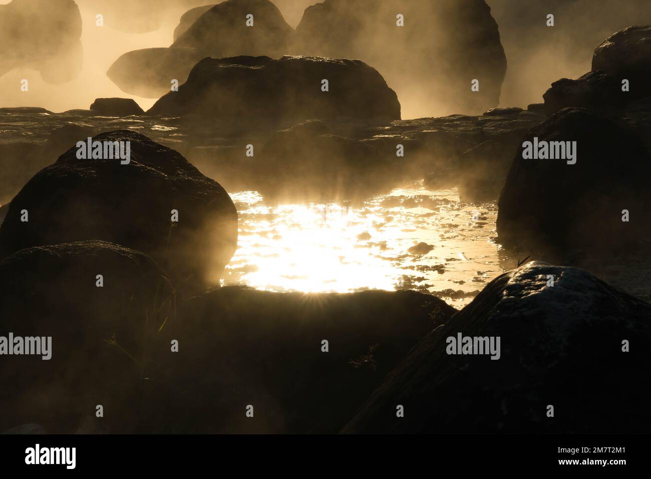 Hot springs and fog in Thailand with morning sunlight. Morning ...