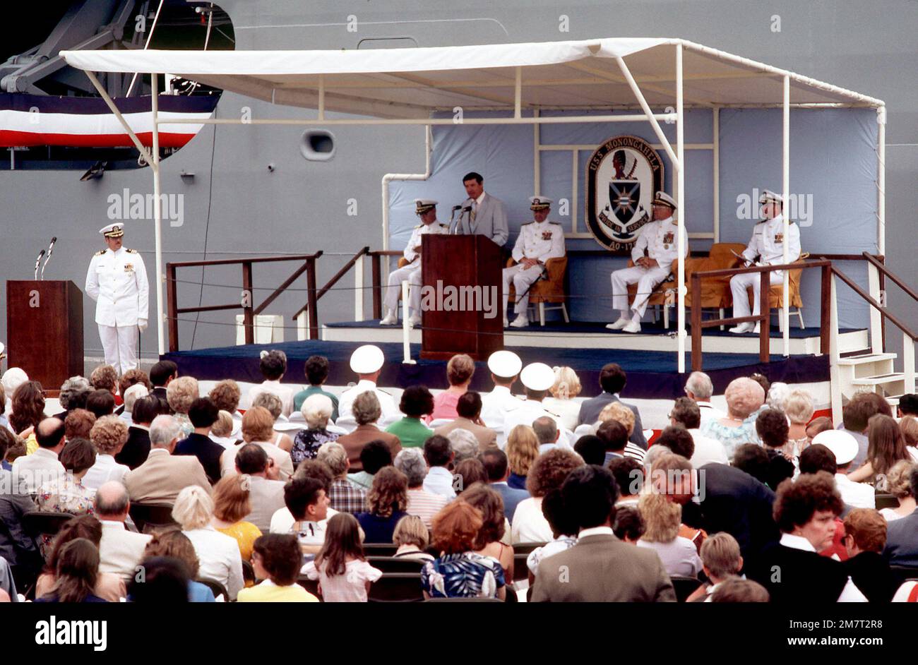 A distinguished guest speaks during the commissioning of the fleet ...