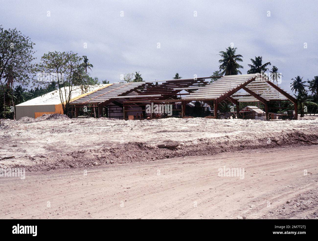 A view of the roof frame of a partially-constructed building. Base: Nav ...