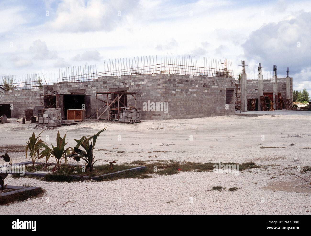 An exterior view of a partially-constructed building during a lull in ...