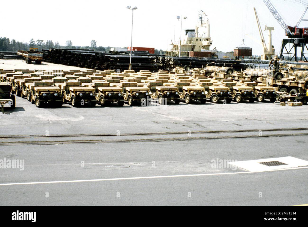 A wide angle view of the staging area with M-151A1 jeeps, M-54 5-ton ...