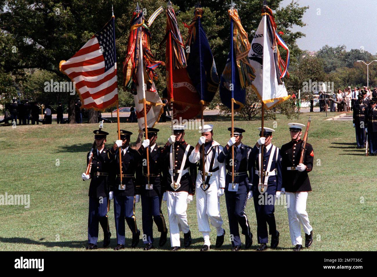 Joint-service color guards march during a ceremony for the dedication ...