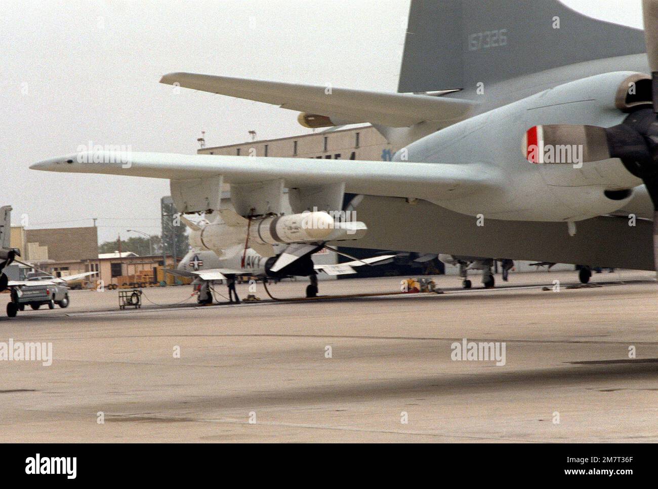 A view of a Harpoon missile on the right wing of a P-3 Orion aircraft ...