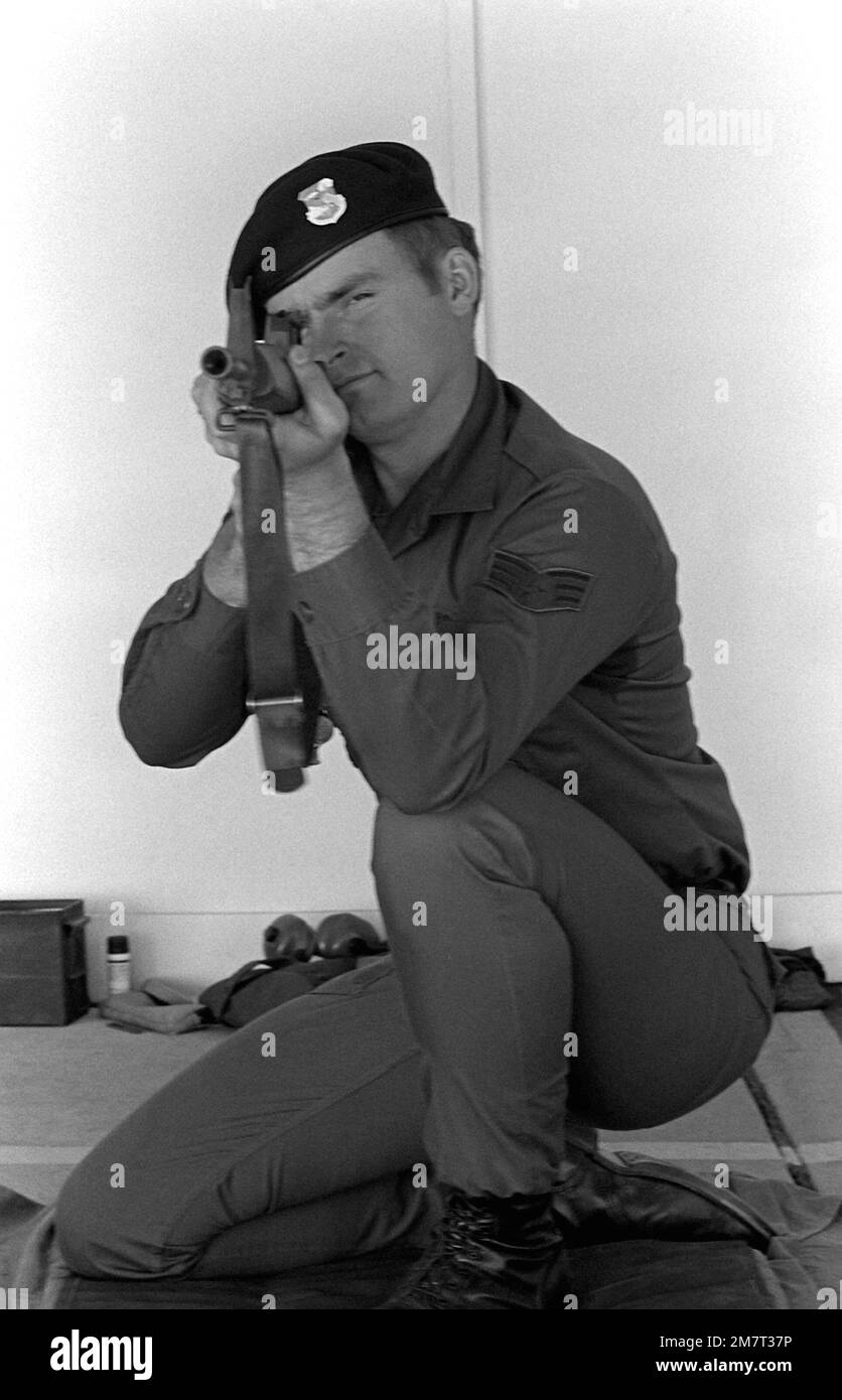 At the firing range, one of the security police fires his M-16A1 rifle ...