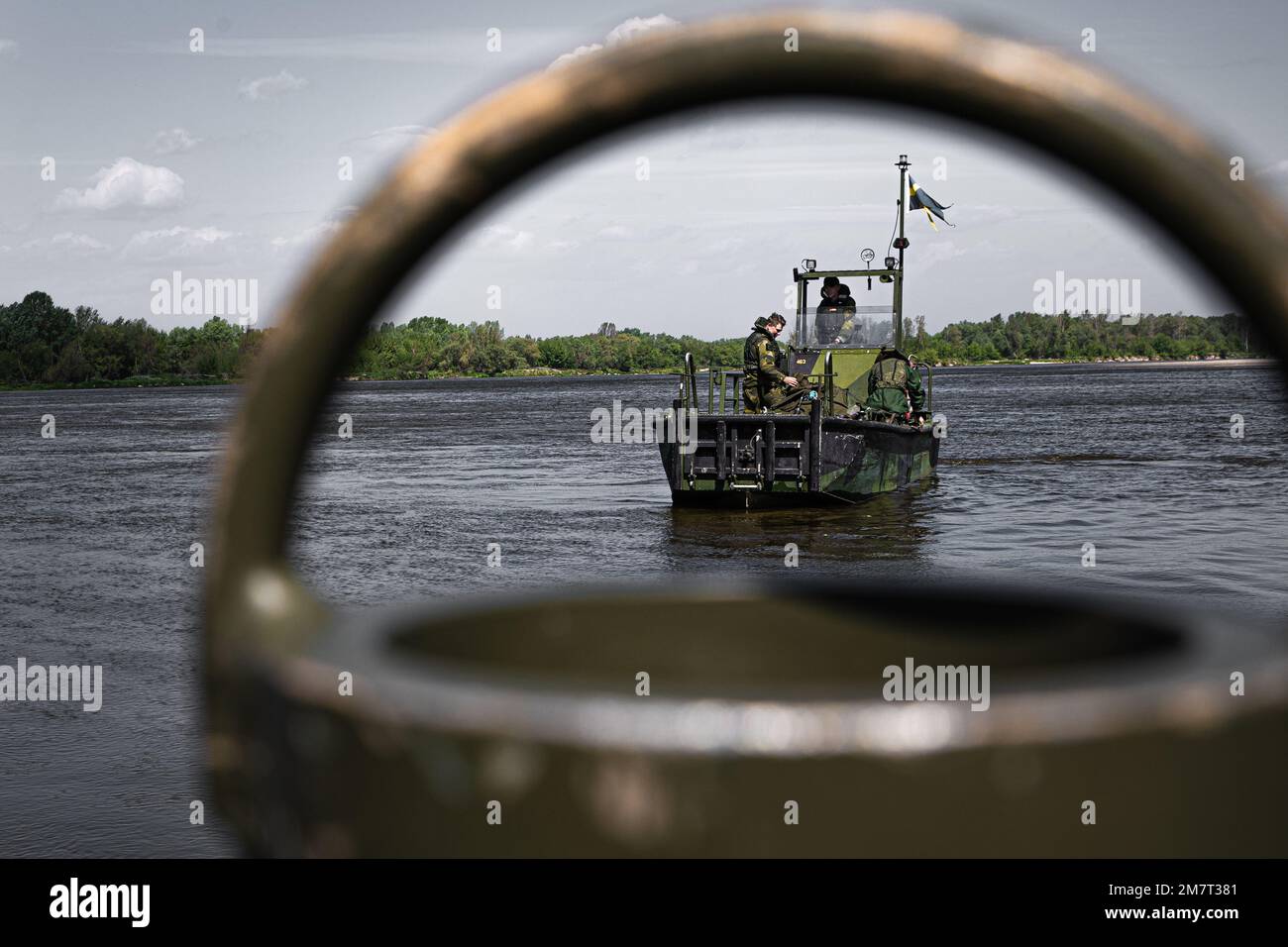 Swedish soldiers conduct a wet-gap crossing operation as part of ...