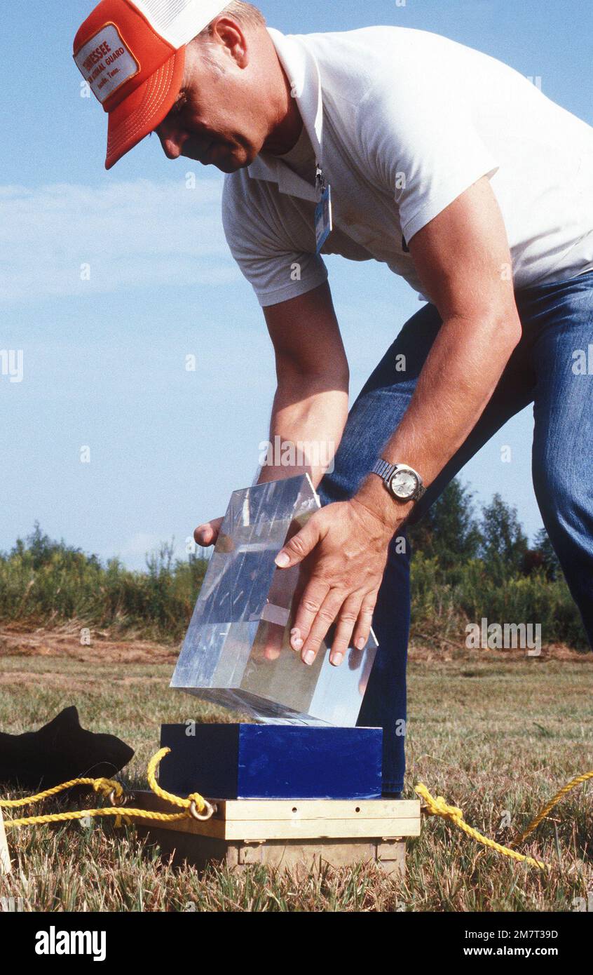 A Krypton 85 light fixture is placed into position on the runway during ...