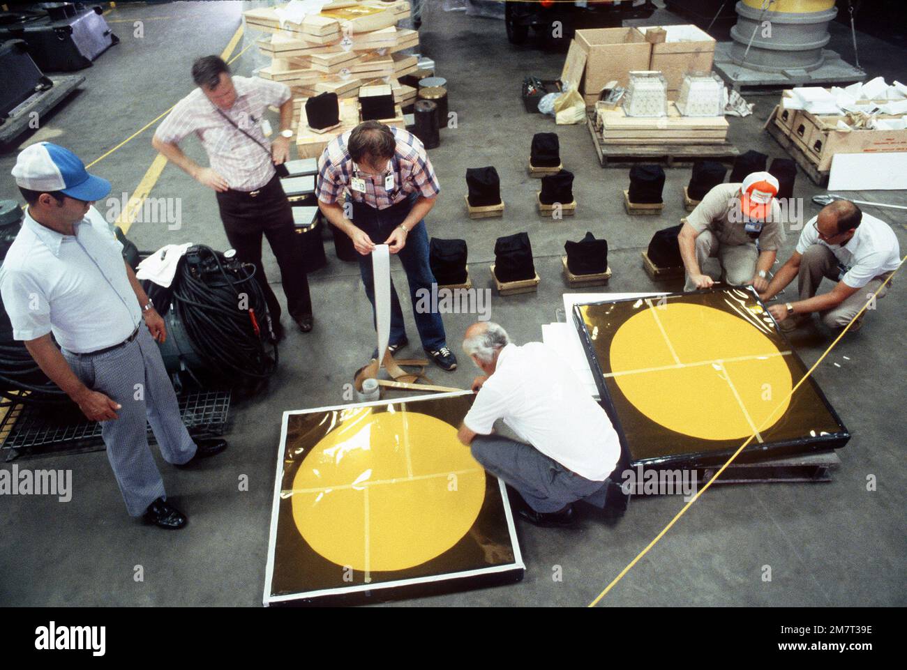 Test personnel assemble and tear down the Krypton 85 lights used during ...
