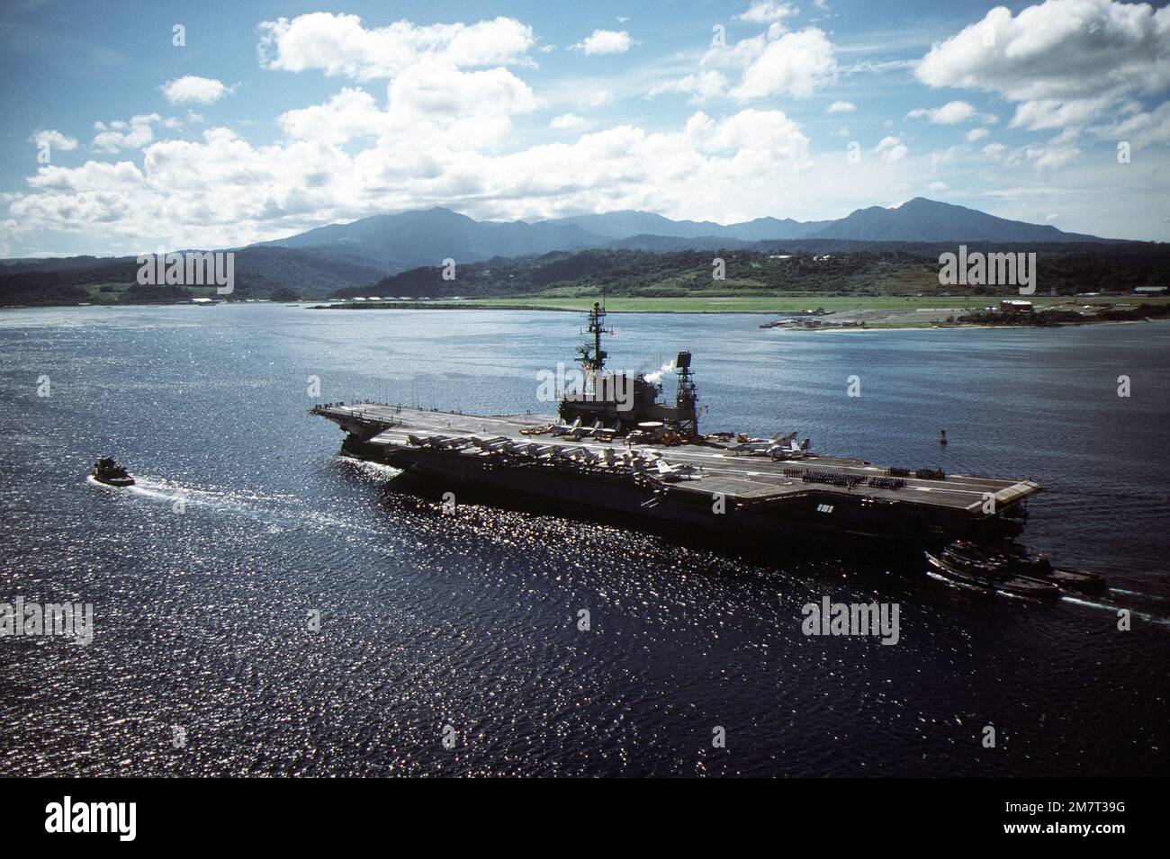 An elevated port quarter view of the aircraft carrier USS MIDWAY (CV-41 ...