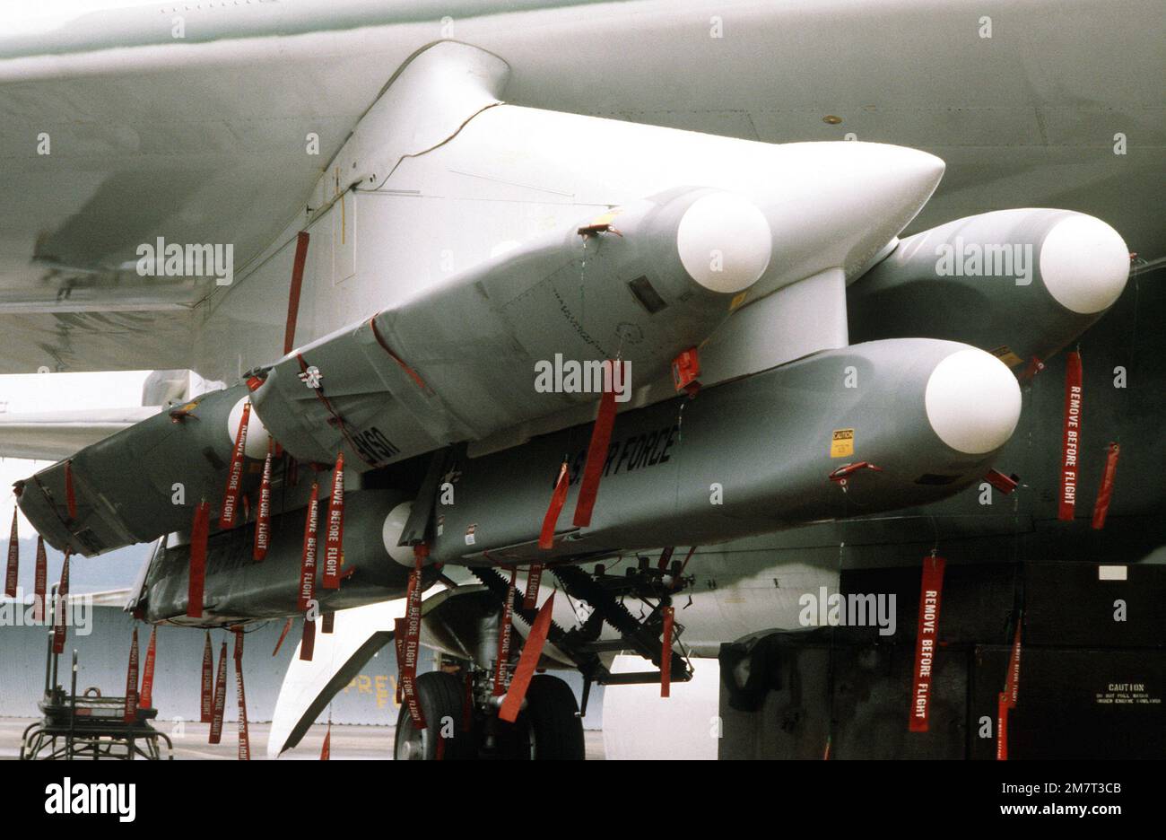 A right front view of three Air-Launched Cruise Missiles mounted to the ...