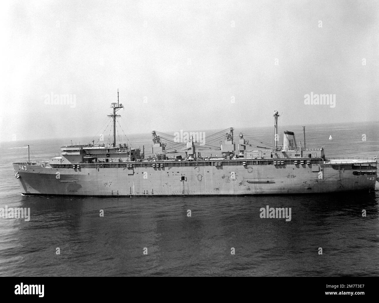 A port beam view of the destroyer tender USS CAPE COD (AD-43) underway ...