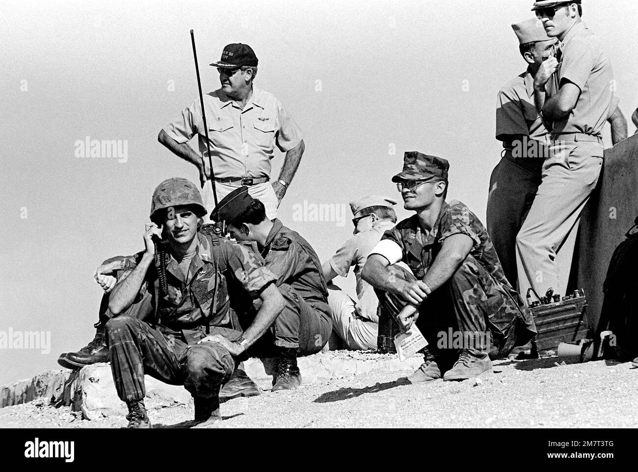 Marine and Navy personnel watch amphibious operations from a command ...