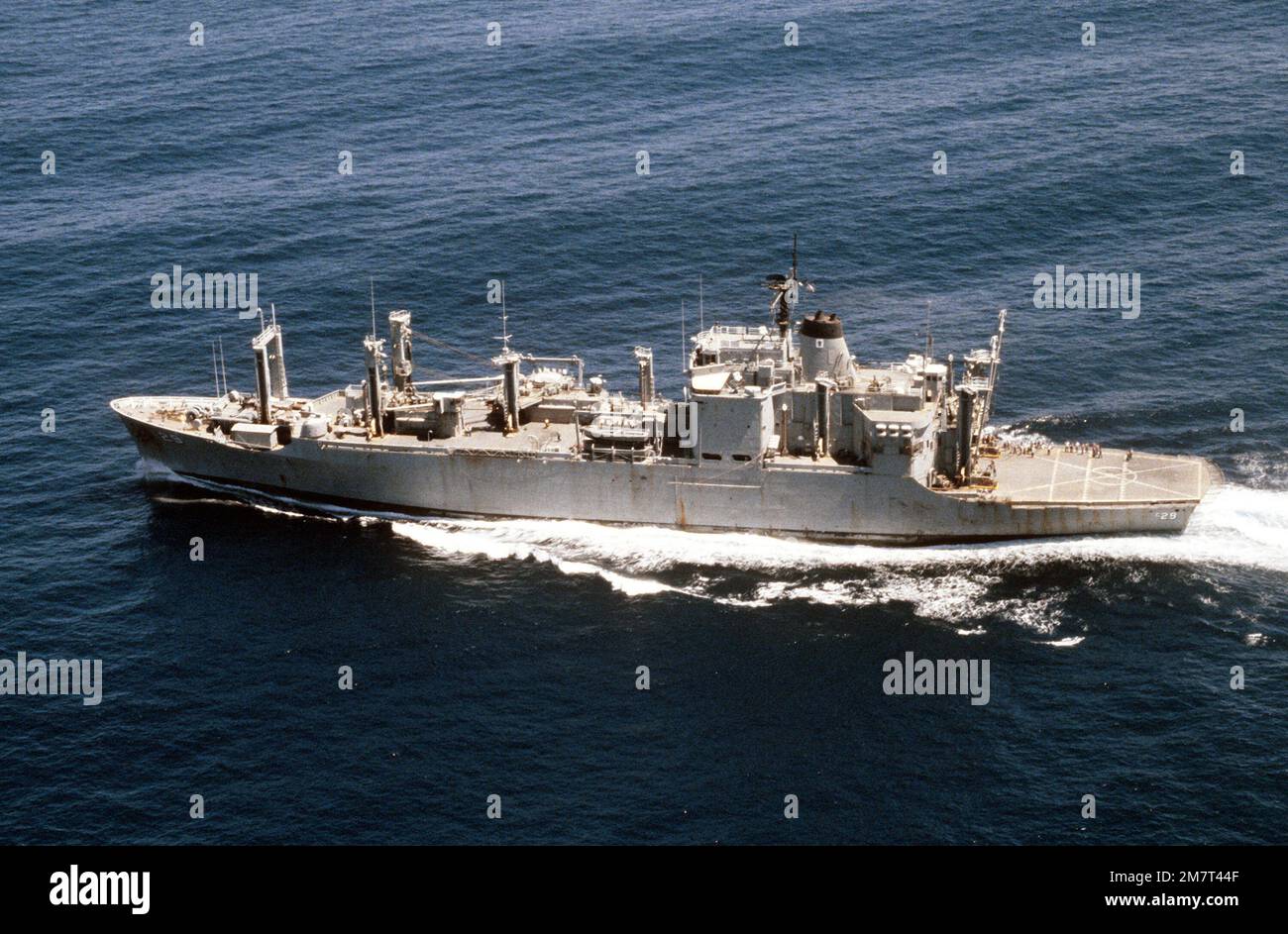 Aerial port beam view of the ammunition ship USS MOUNT HOOD (AE-29) en ...