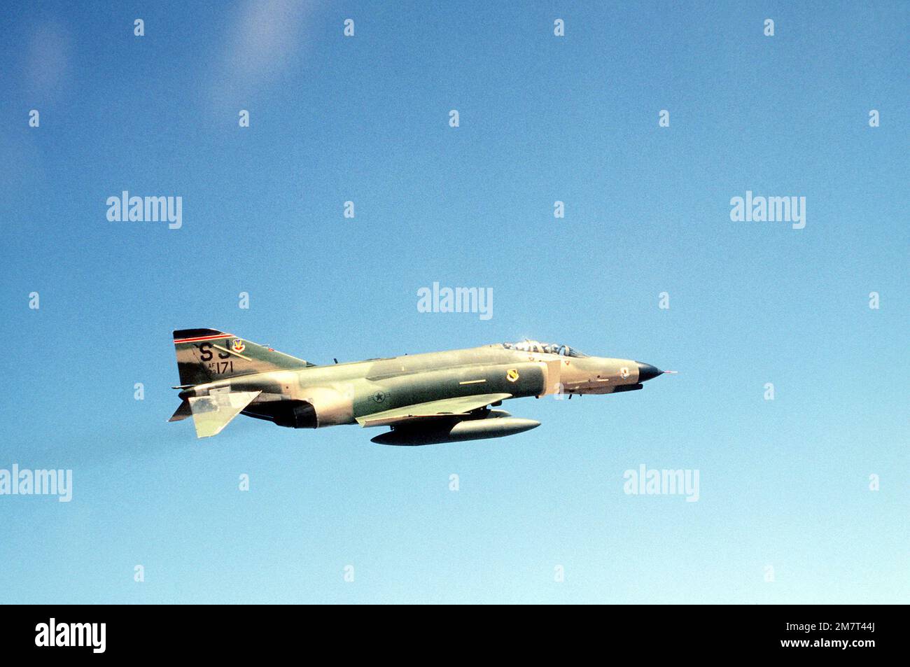 A right side view of an F-4 Phantom II aircraft in flight during ...