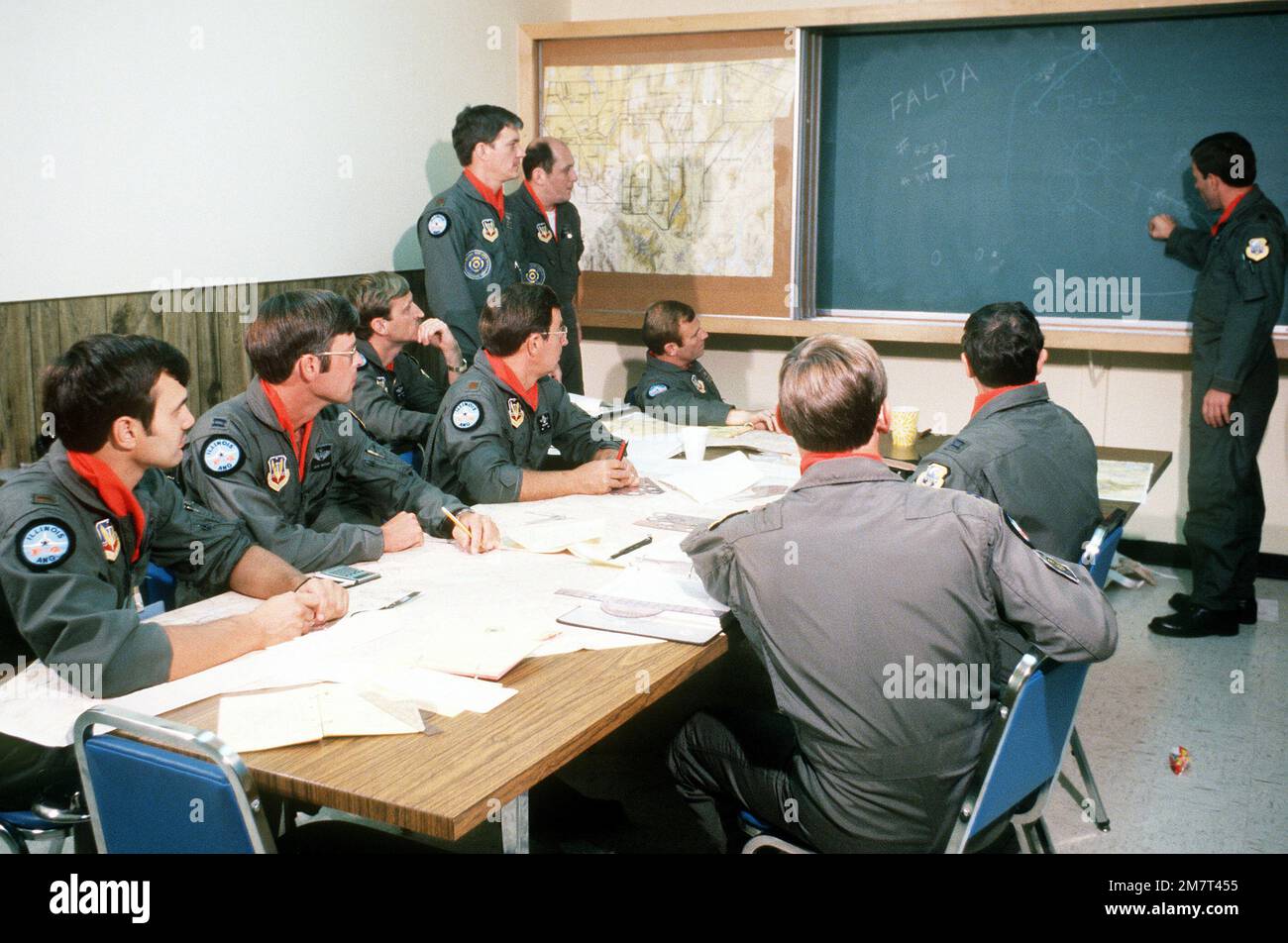 MAJ Herb Parks maps out the shooting range at a pre-flight briefing ...
