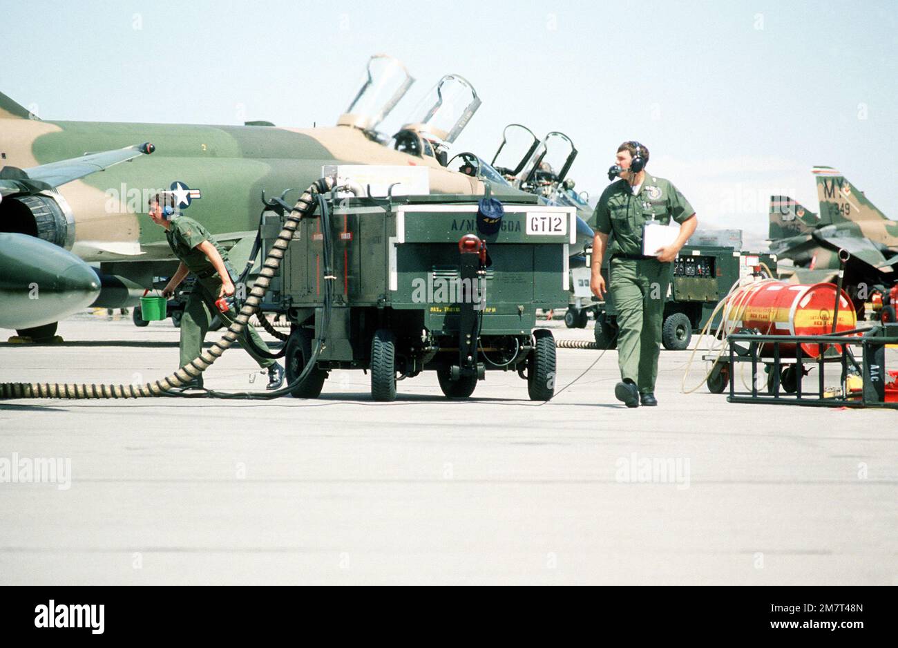 Ground crewmen ready F-4 Phantom II aircraft for flight during ...