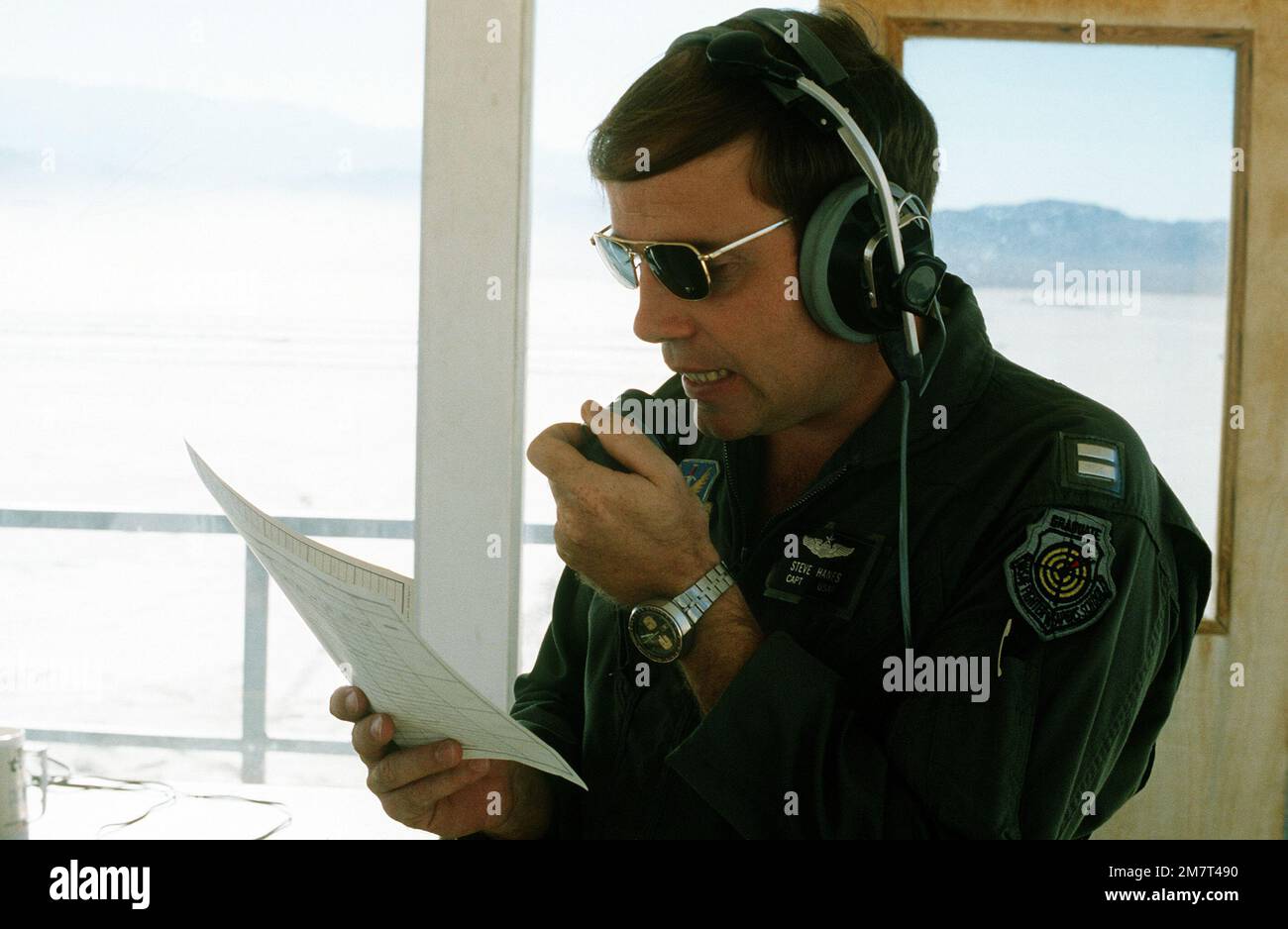 A tower observer at a bombing range, relays target information back to ...