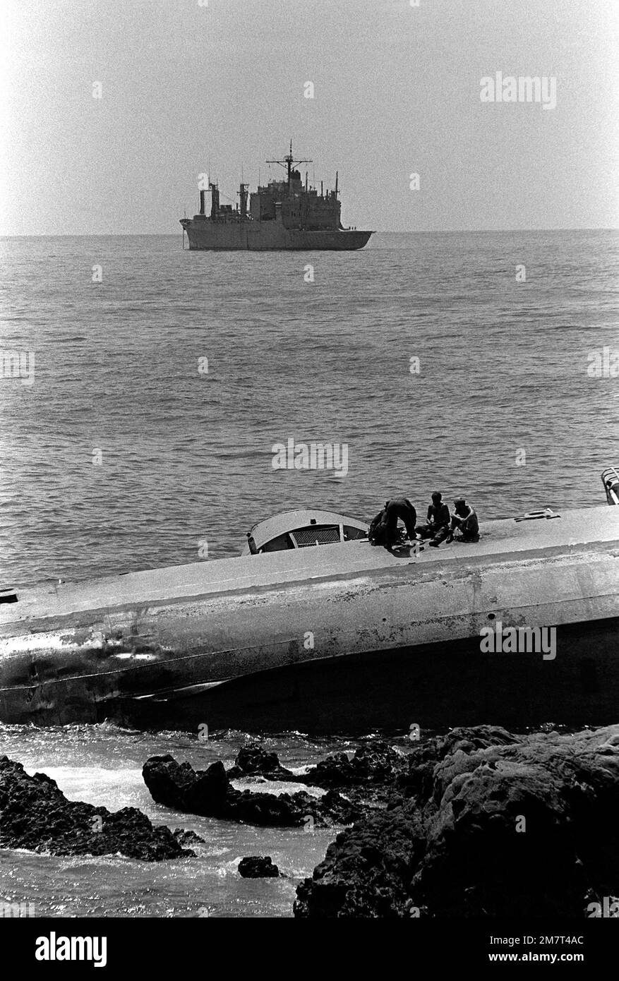 A port quarter view of the ammunition ship USS MOUNT HOOD (AE-29) as ...