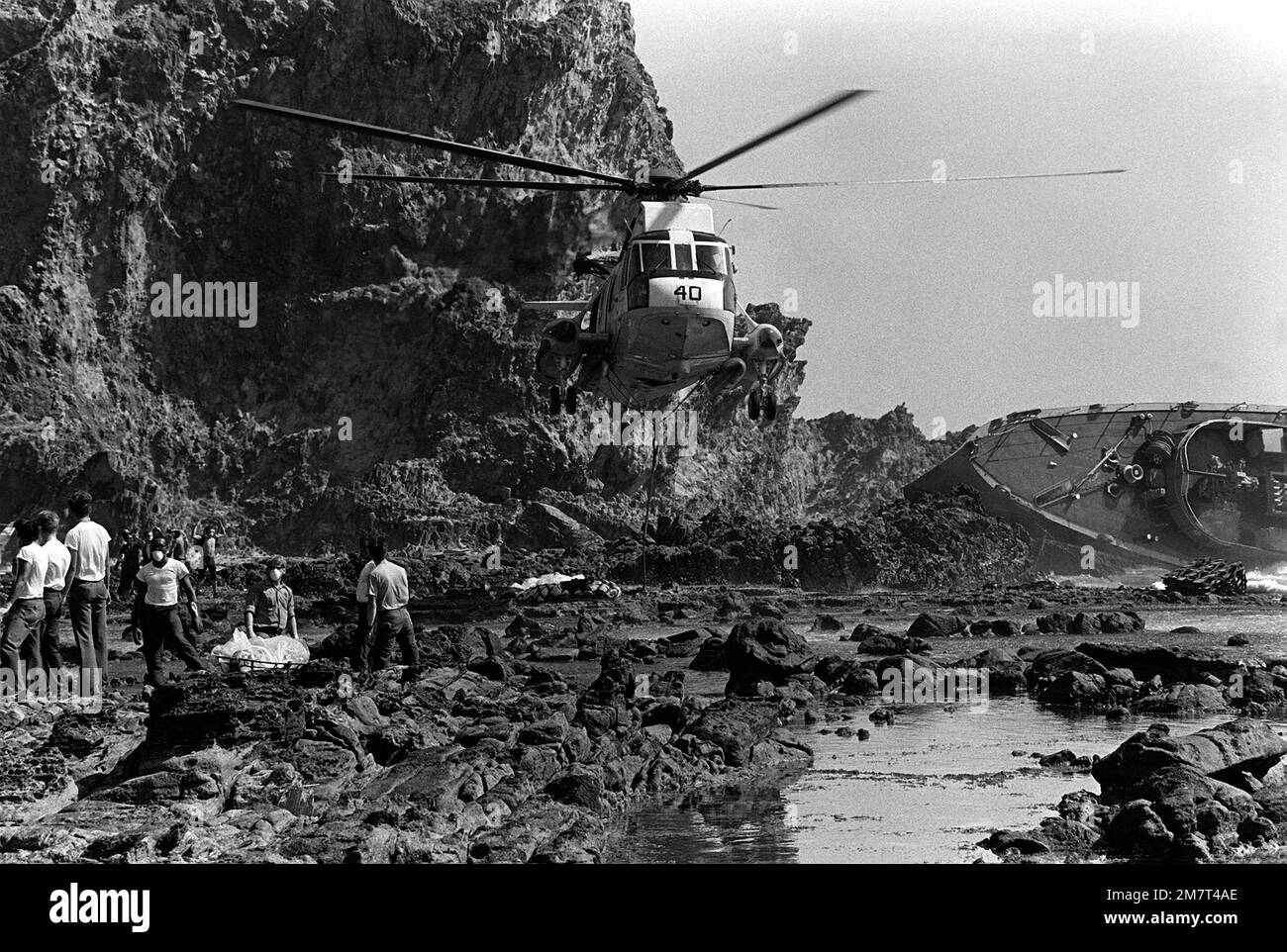 Crewmen from the ammunition ship USS MOUNT HOOD (AE-29), not visible ...