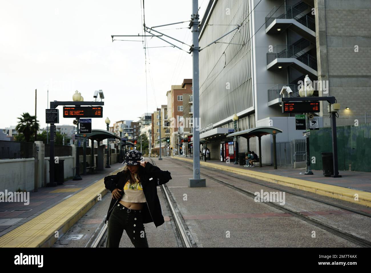 The model is posed on the train tracks. Shot at high shutter speed ...