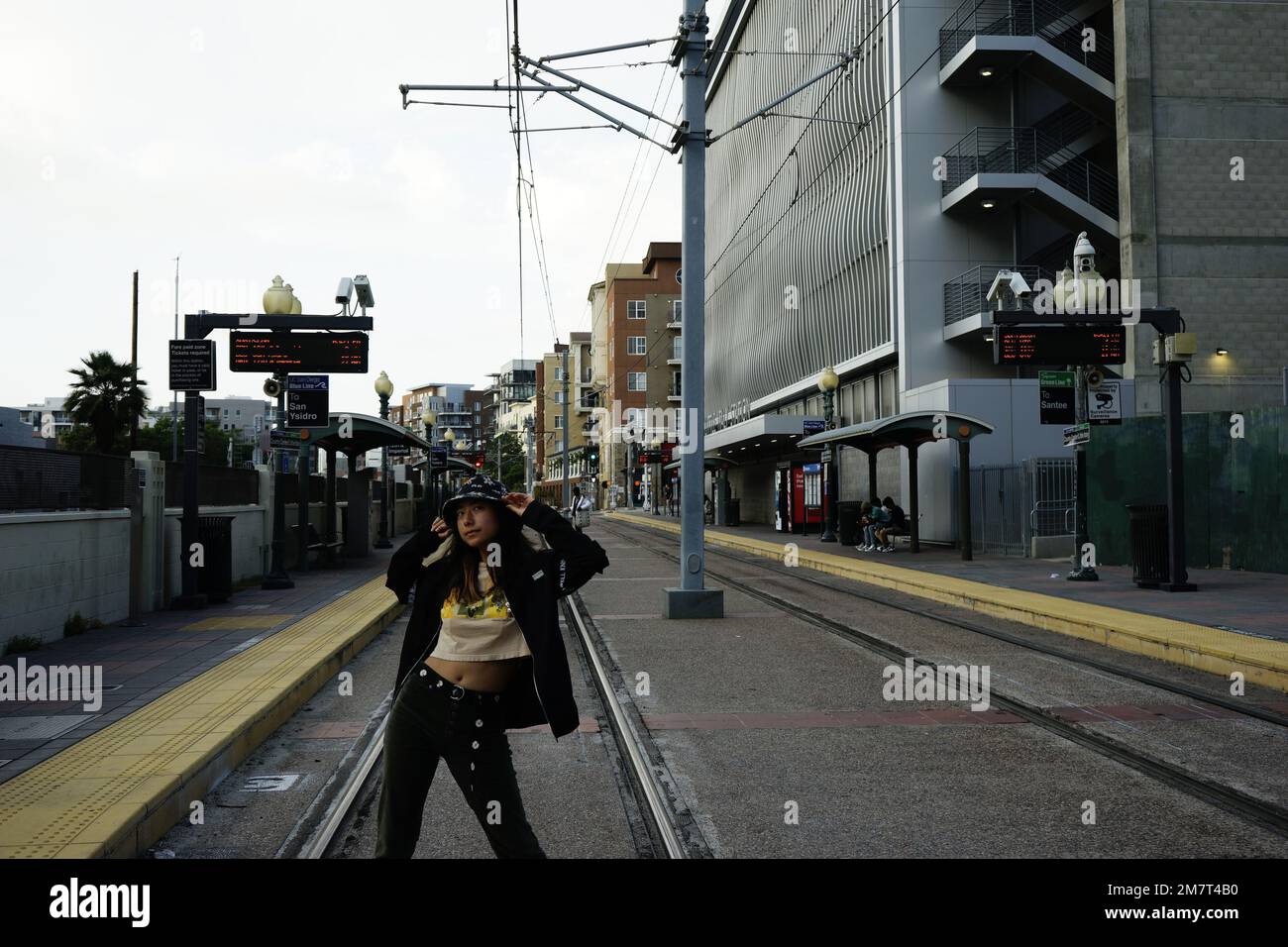 The model is posed on the train tracks. Shot at high shutter speed ...