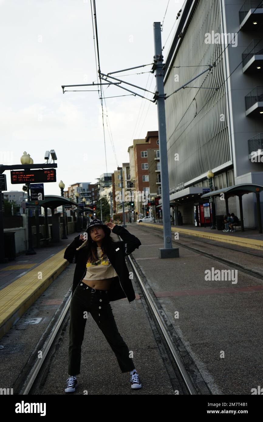 The model is posed on the train tracks. Shot at high shutter speed ...