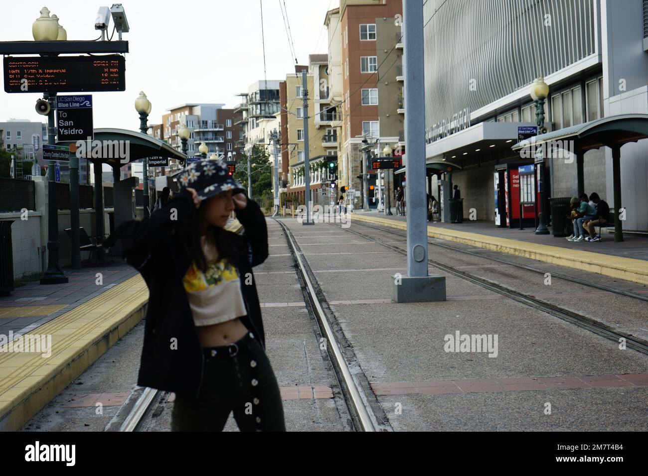 The model is posed on the train tracks. Shot at high shutter speed ...